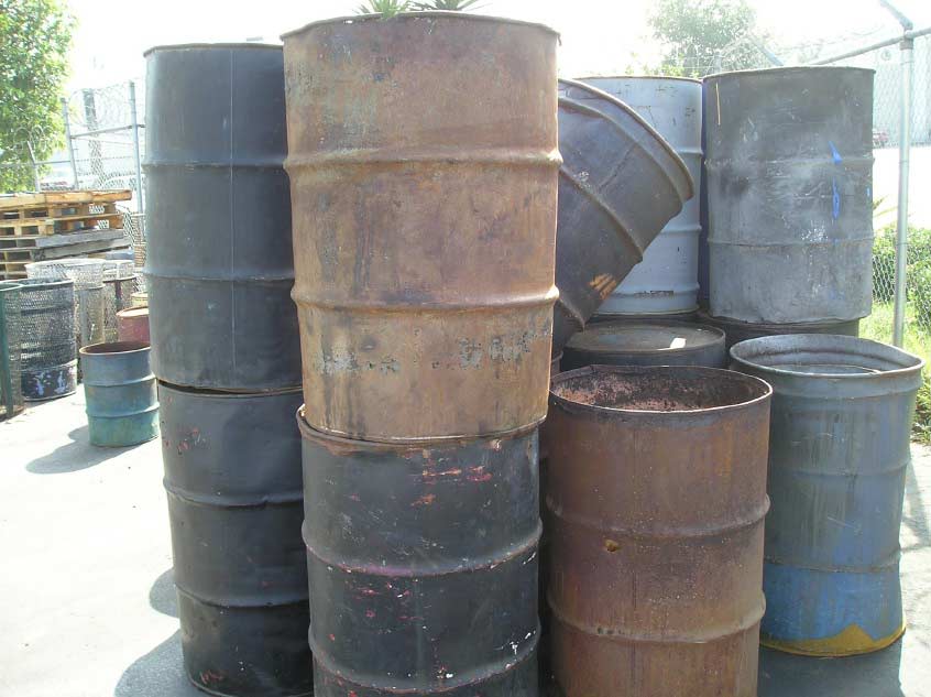 Aged 55 Gallon Metal Barrels in Industrial