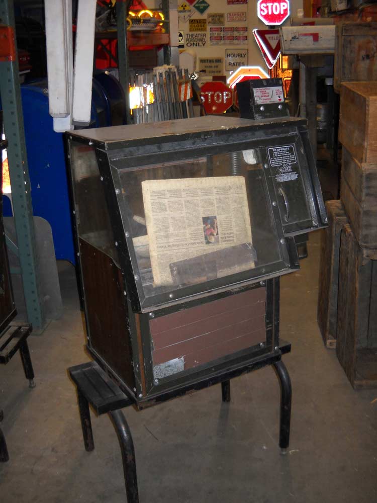 Newspaper Dispenser with Legs- vintage in Street / Alley